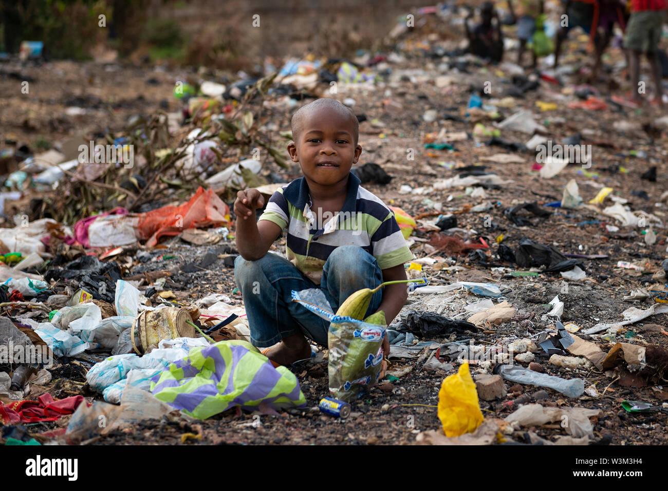 Boy garbage dump hi-res stock photography and images - Alamy