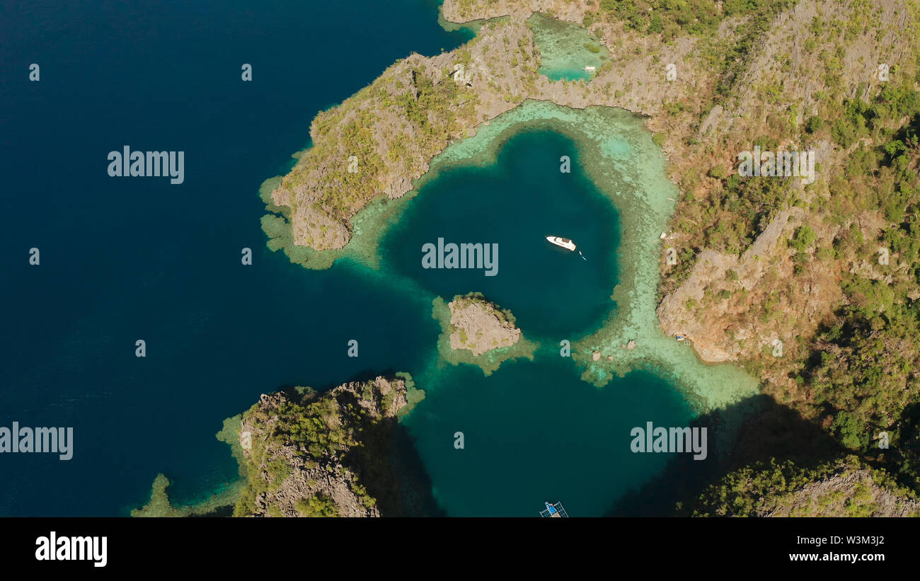 blue lagoons and cliffs of tropical mountain island. aerial view ...