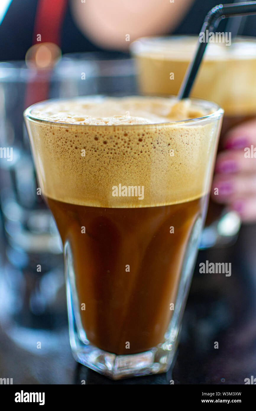 Traditional greek cold coffee Frappe with foam made from water, instant ...