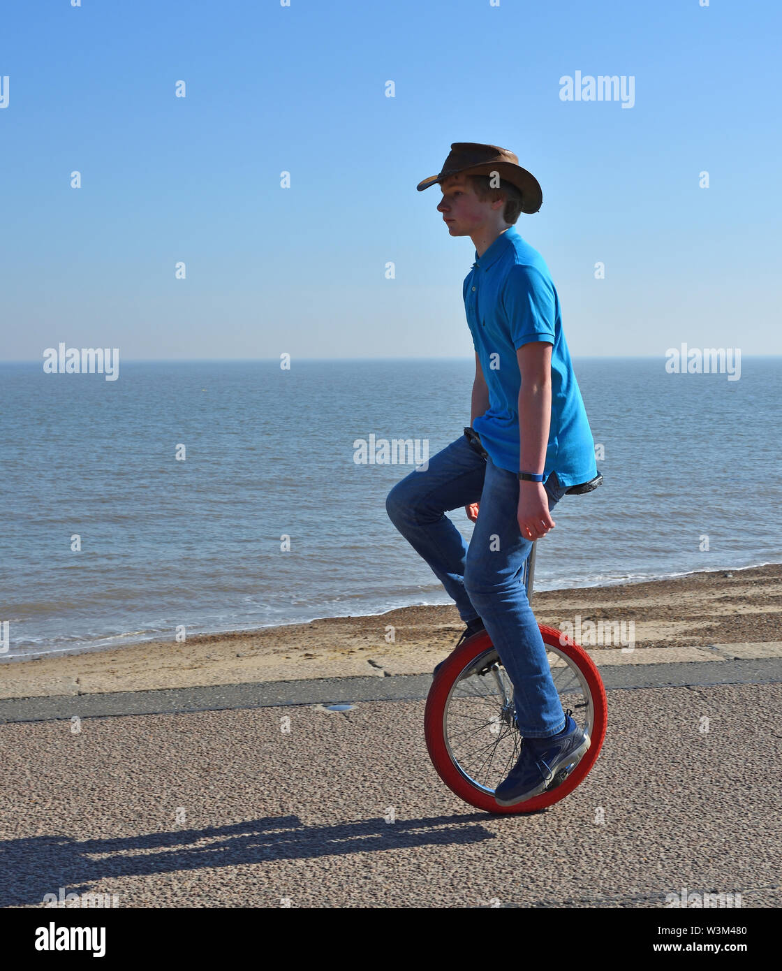 Man riding unicycle hi-res stock photography and images - Alamy