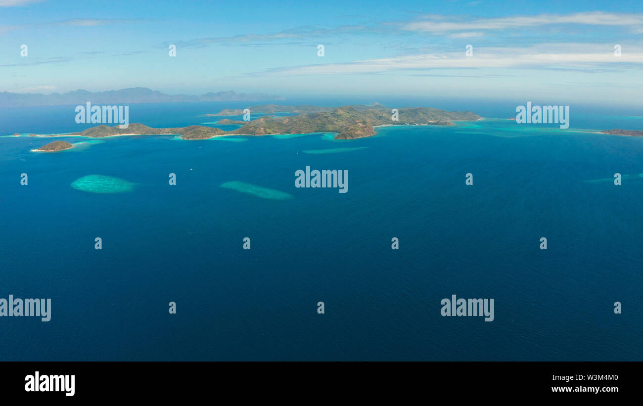 aerial view tropical islands with blue lagoon, coral reef and sandy ...