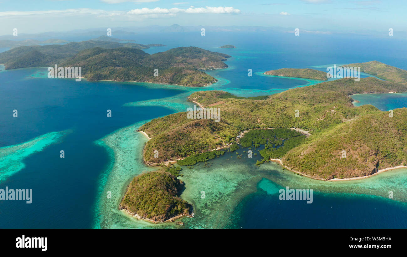 aerial view tropical islands with blue lagoons, coral reef and sandy ...