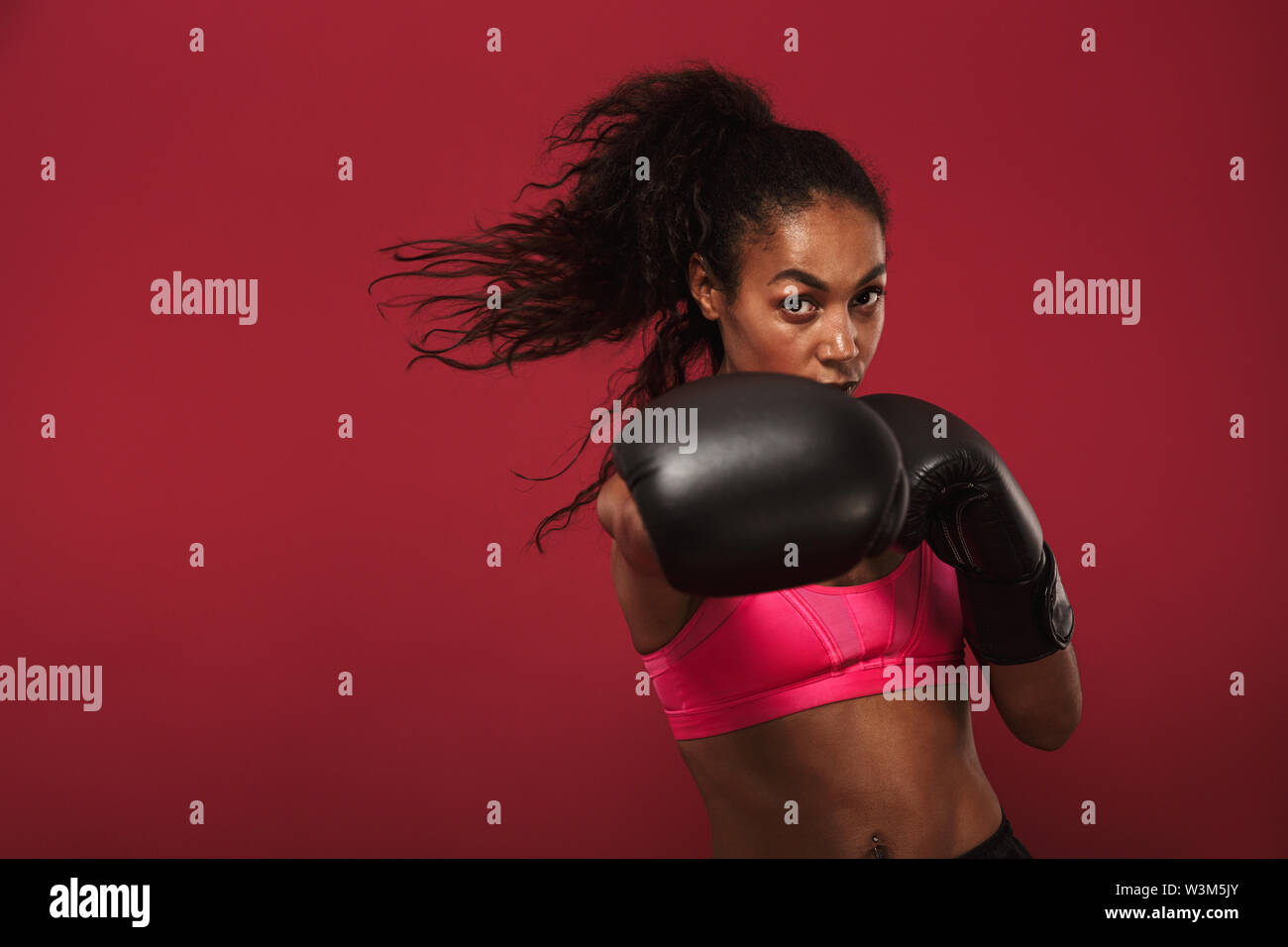 Image of amazing young african sports woman boxer posing isolated over ...