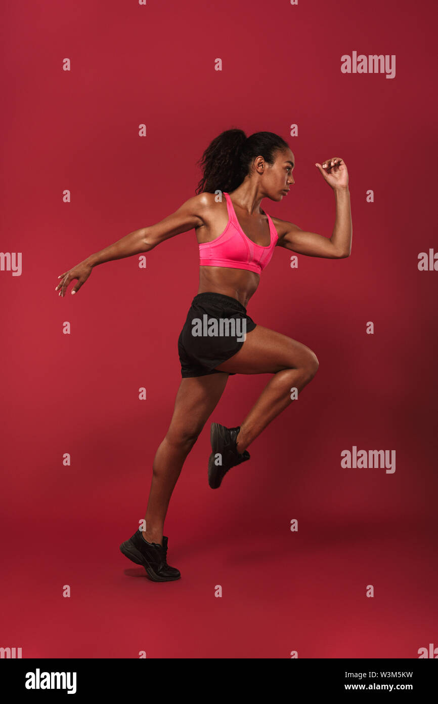 Image of a beautiful runner concentrated strong young african sports ...