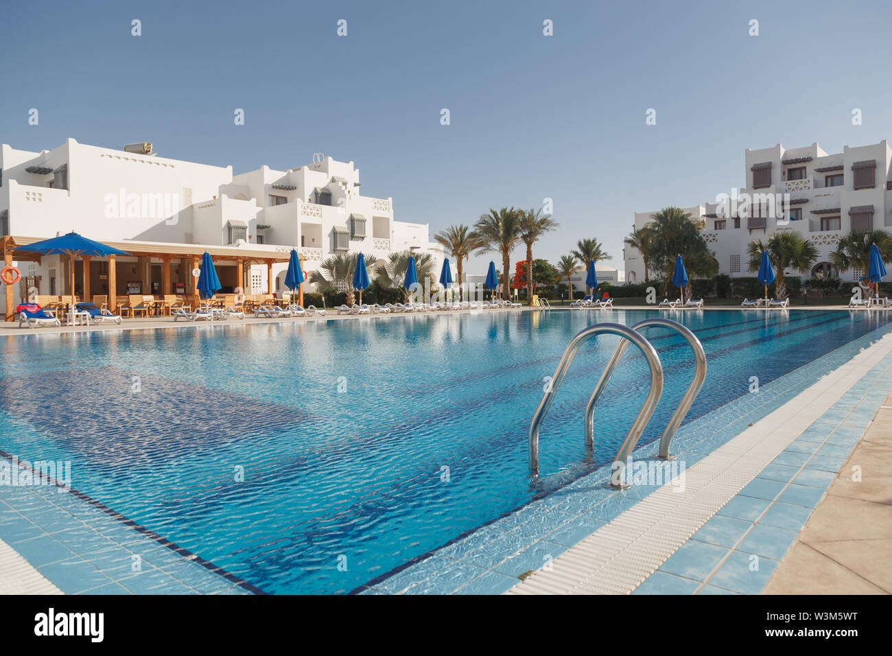 Swim Pool at tropical spa resort Stock Photo - Alamy