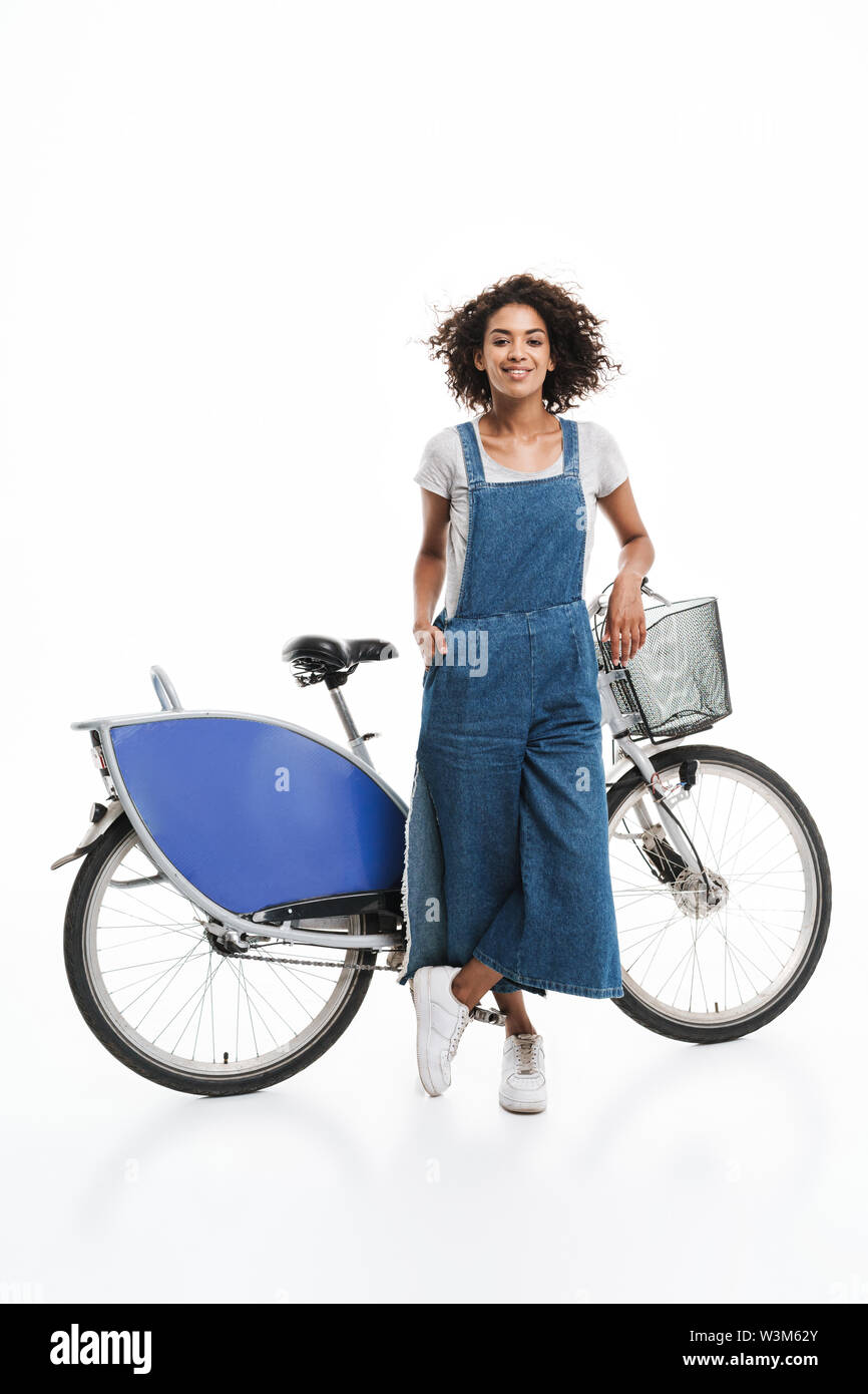 Image of lovely african american woman dressed in denim overalls ...