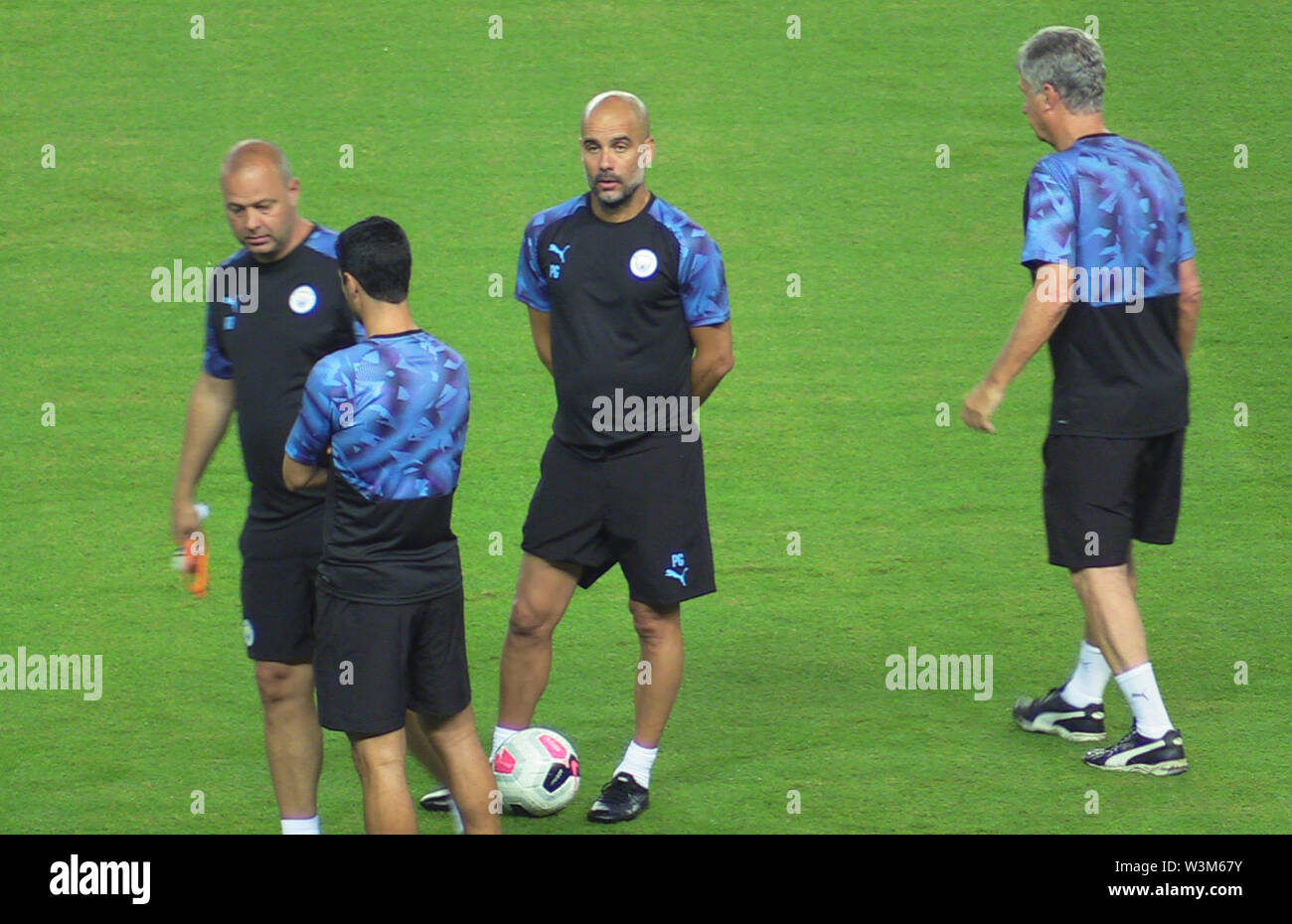 Manchester city manager pep guardiola training session yuanshen stadium ...