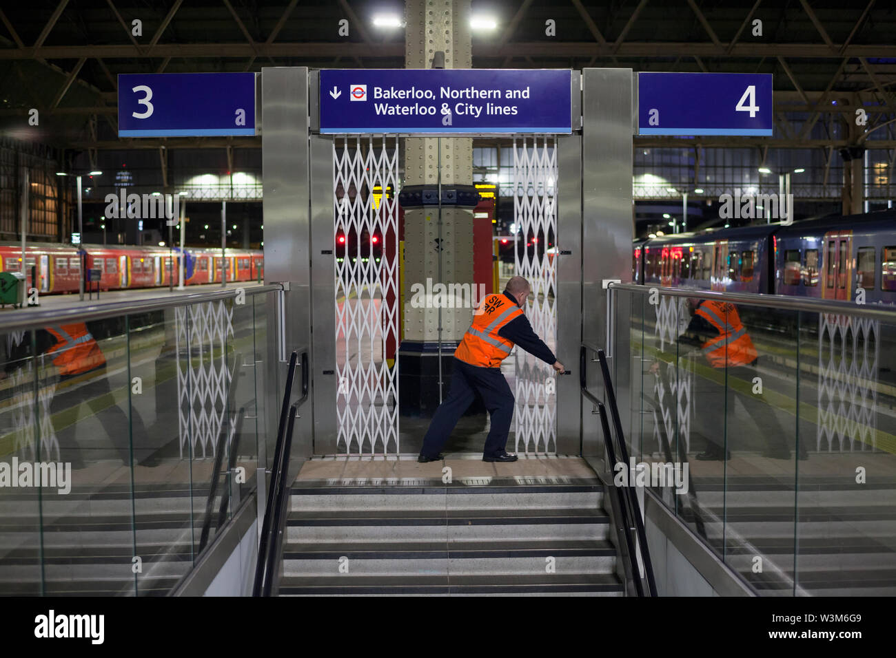 Opening gates from the platform to the underground at London Waterloo ...