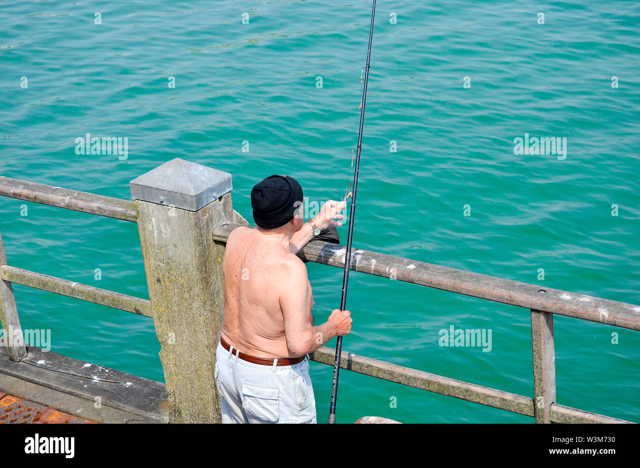 Man in pier fishing hi-res stock photography and images - Alamy