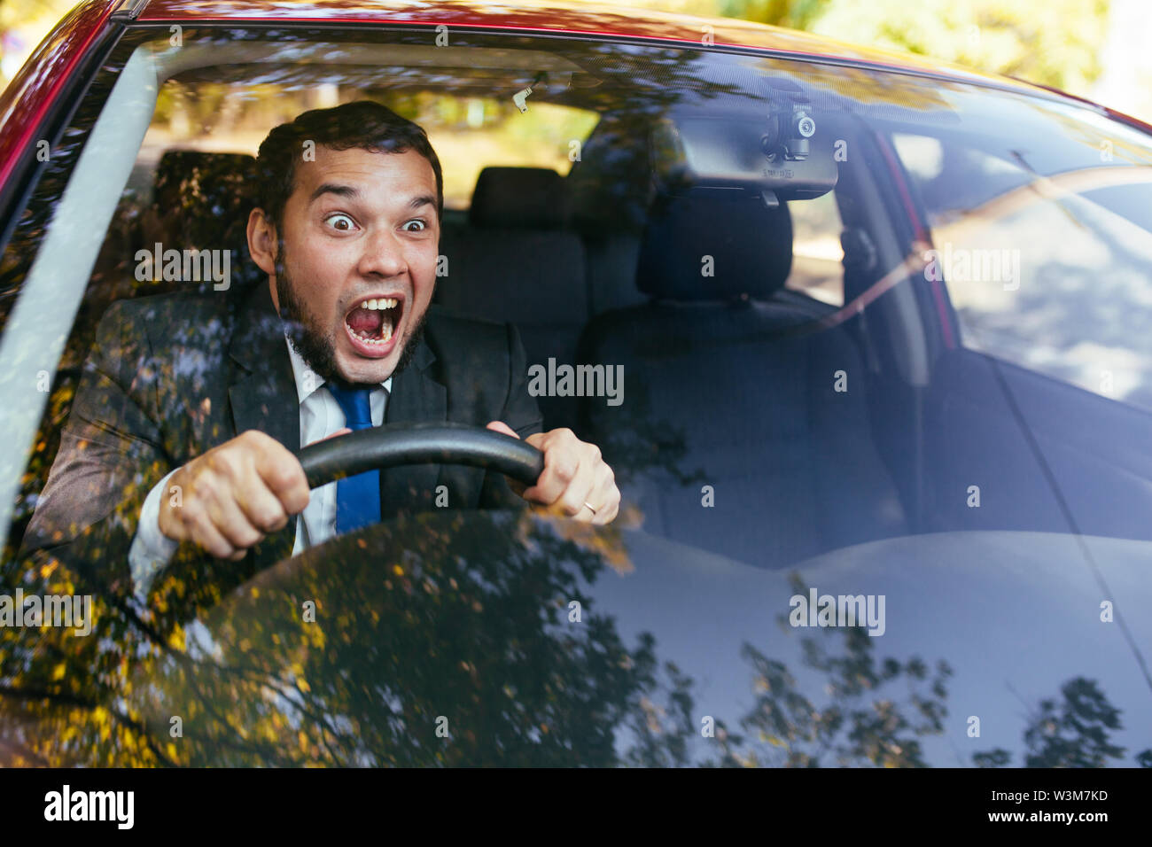 Scared man in car hi-res stock photography and images - Alamy