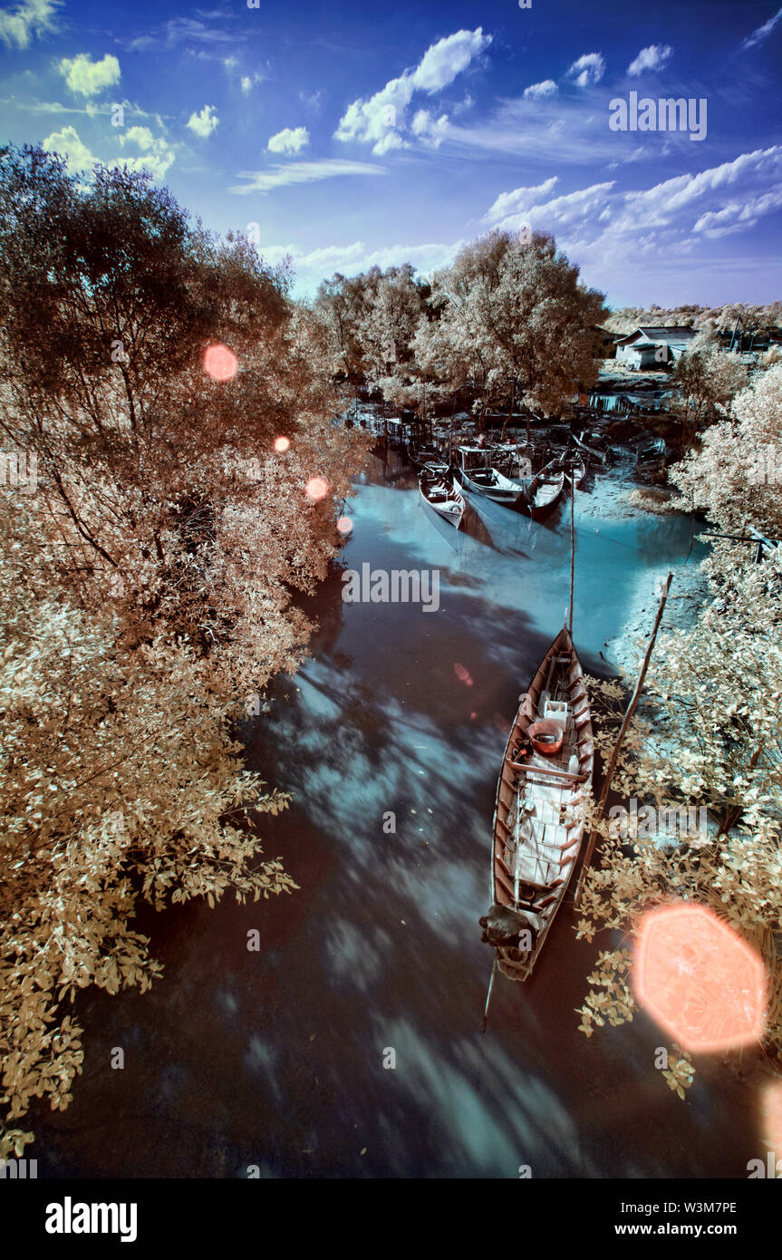 fishing boat at fishing village in infrared colour Stock Photo - Alamy
