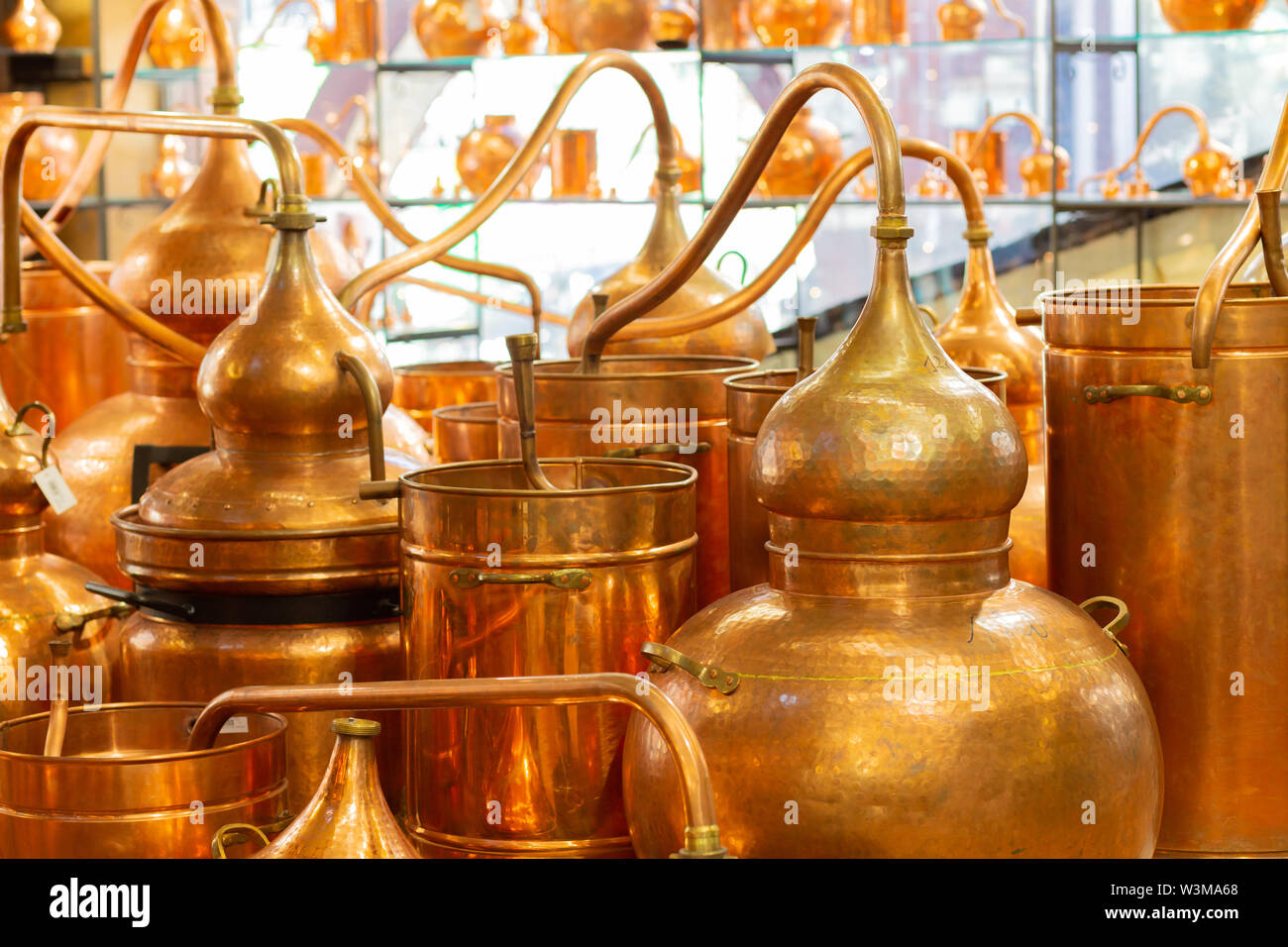 Copper ware, serpentine and jugs on the shop window in the store Stock ...