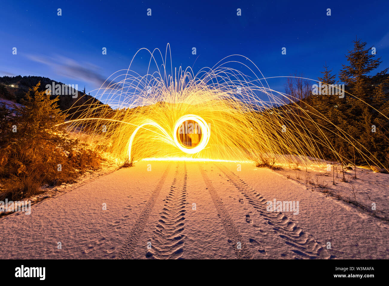 Flaming Steel wool spinning on the middle of a road Stock Photo - Alamy