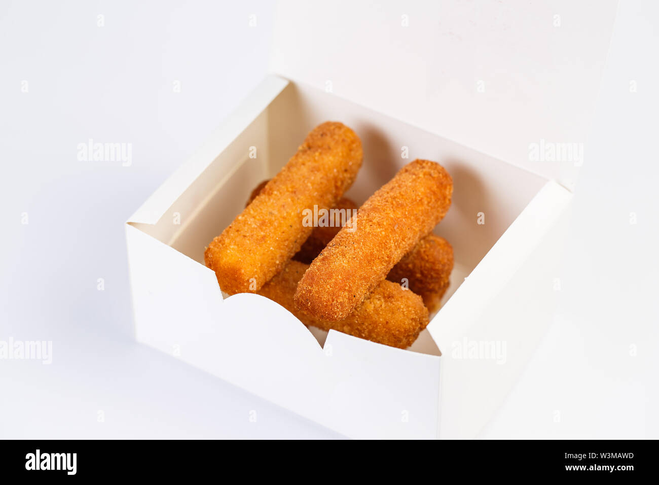 Fried cheese sticks in a white box Stock Photo - Alamy