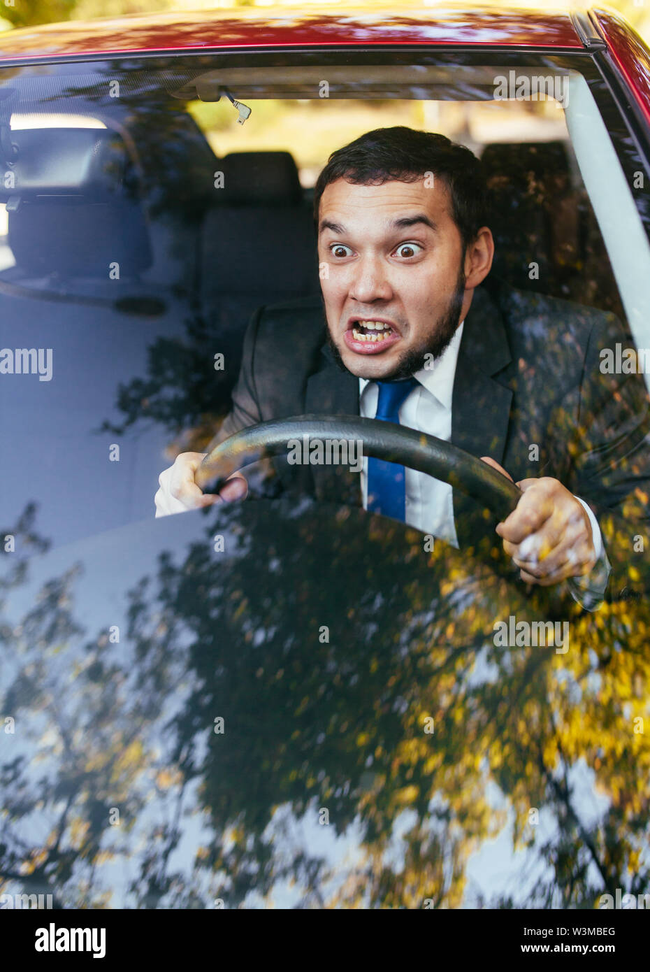 Shocked driver in the car, frightened man driving Stock Photo - Alamy