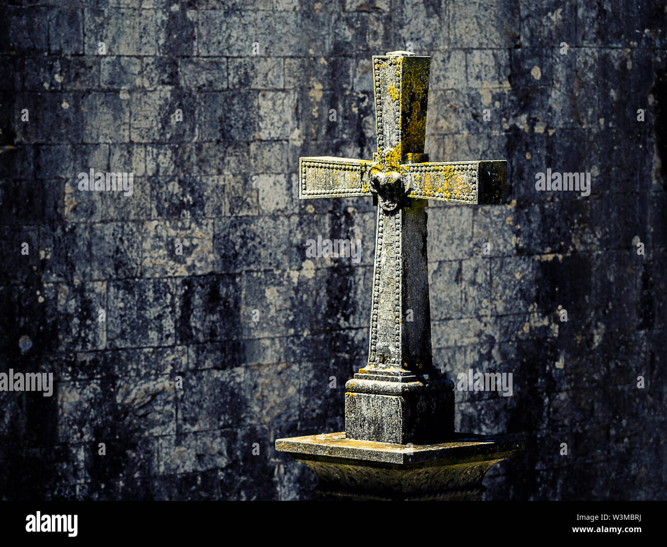Old stone christian cross from a church in Girona (Spain Stock Photo ...