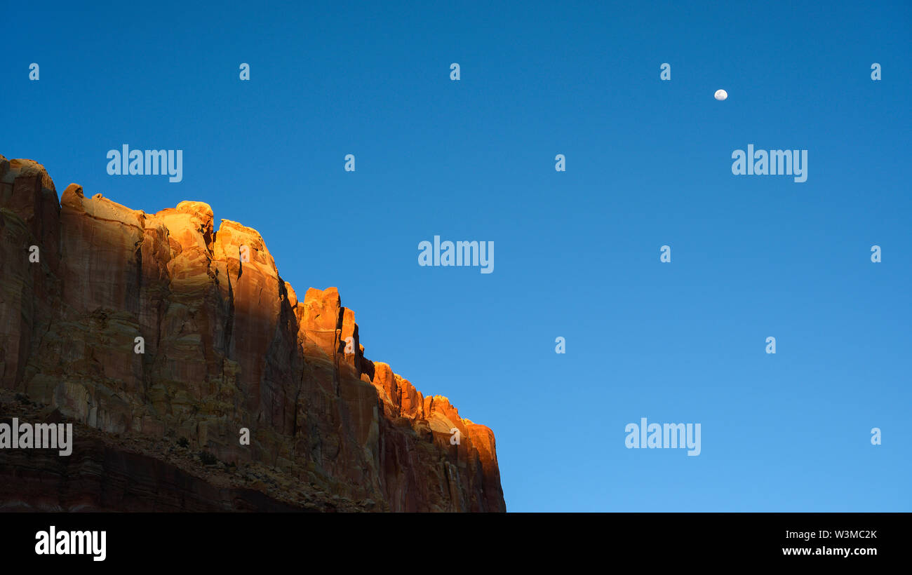 Moon over cliff in shadow in Capitol Reef National Park, USA Stock ...