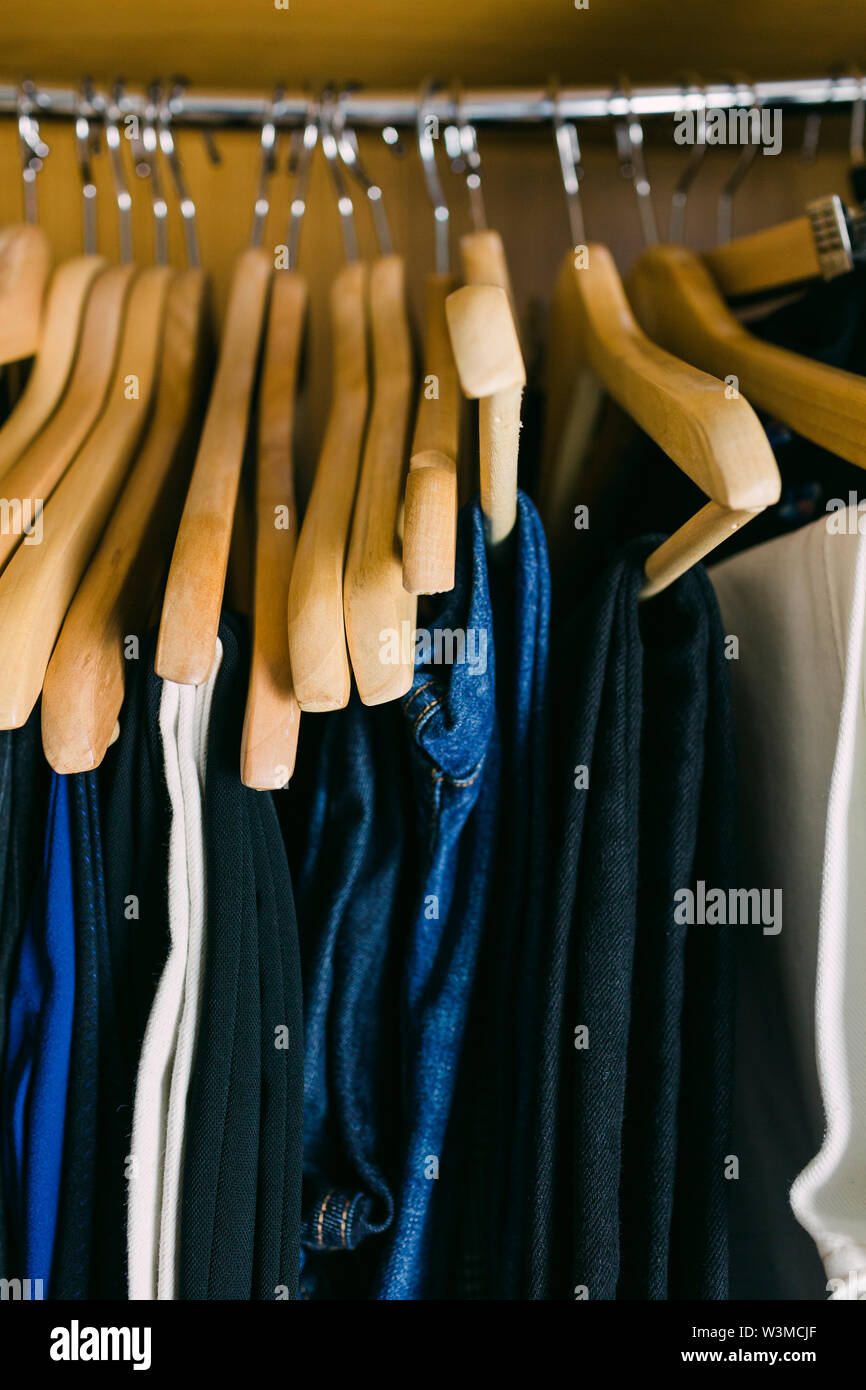 Clothes in wardrobe Stock Photo - Alamy