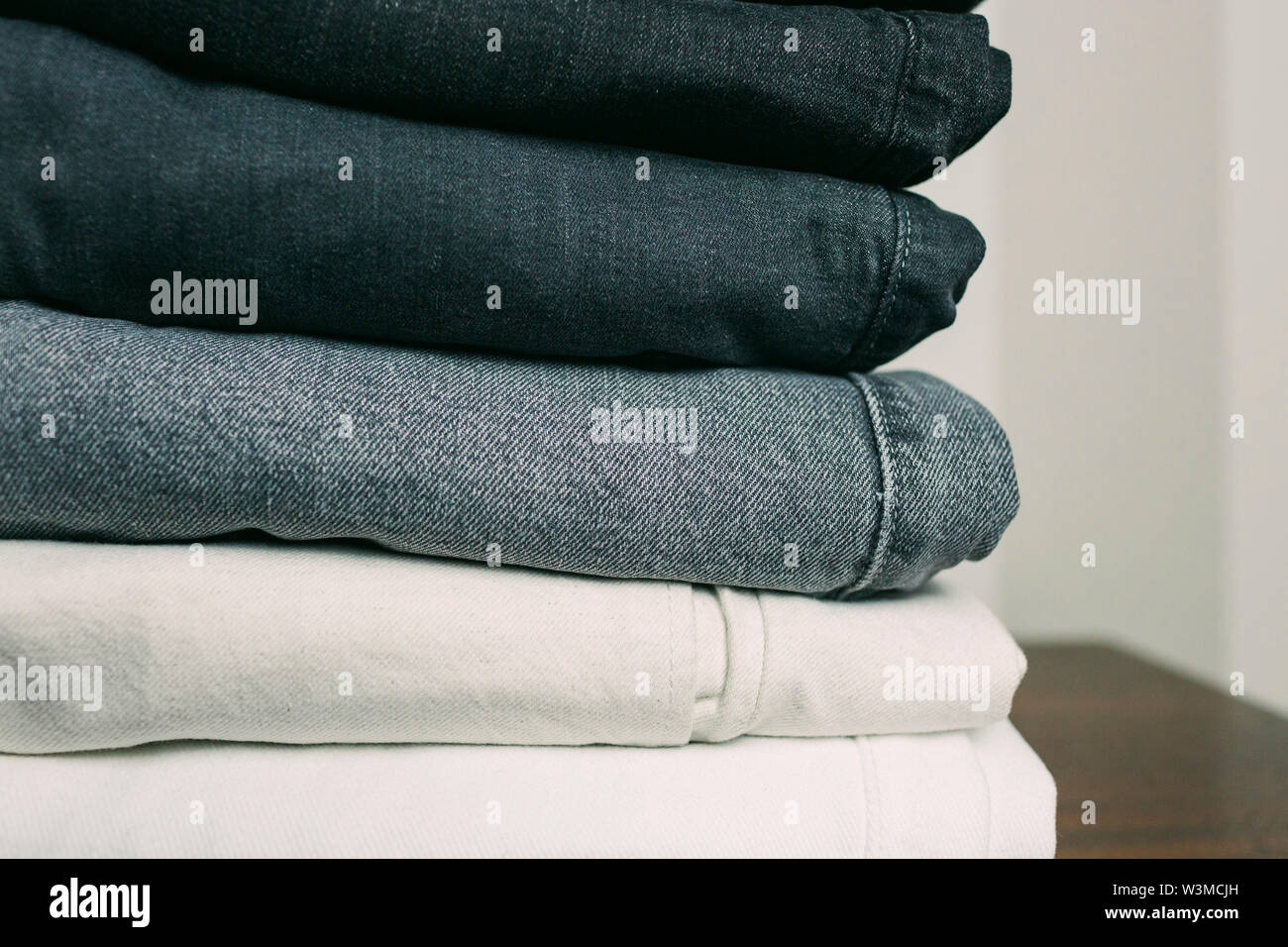 Stack of folded clothes Stock Photo - Alamy