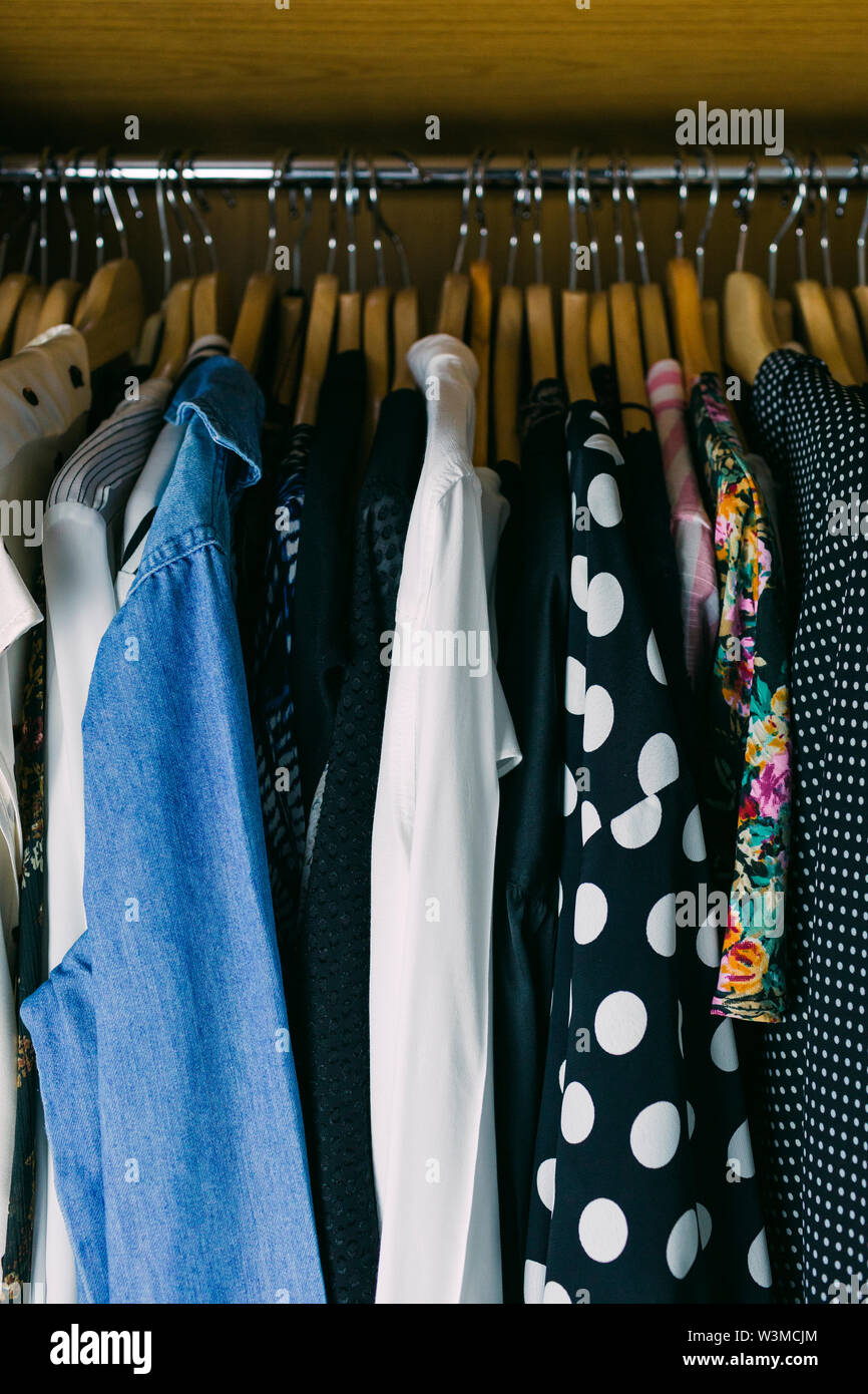 Clothes in wardrobe Stock Photo - Alamy