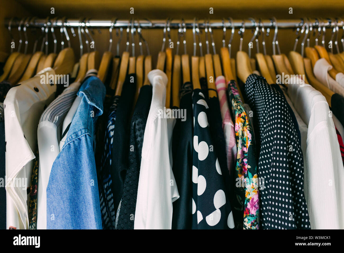Clothes in wardrobe Stock Photo - Alamy