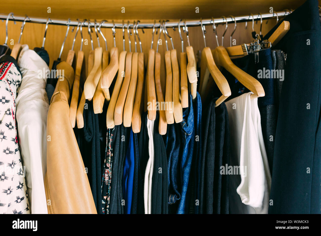 Clothes in wardrobe Stock Photo - Alamy