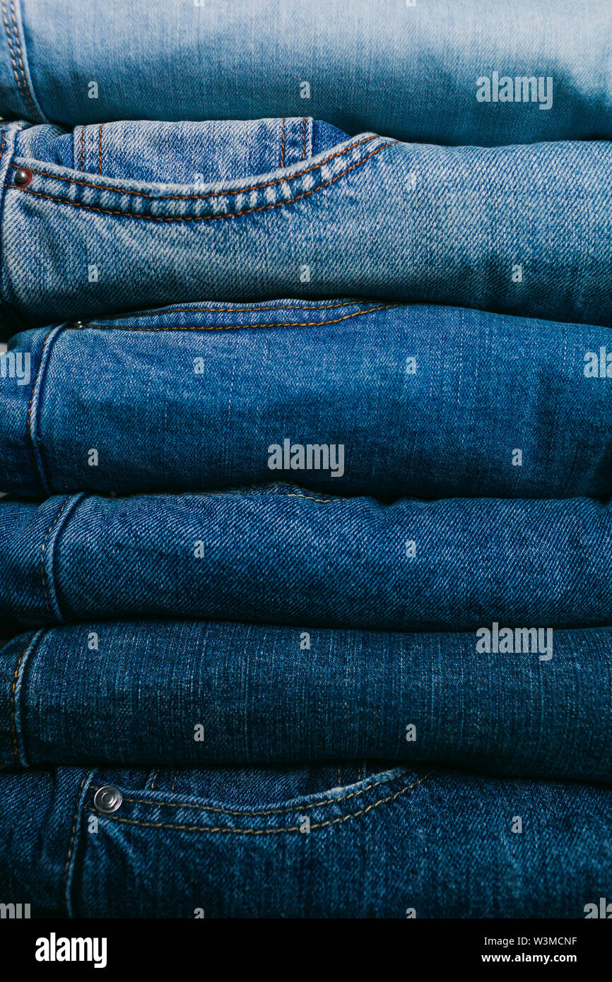 Stack of folded jeans Stock Photo - Alamy