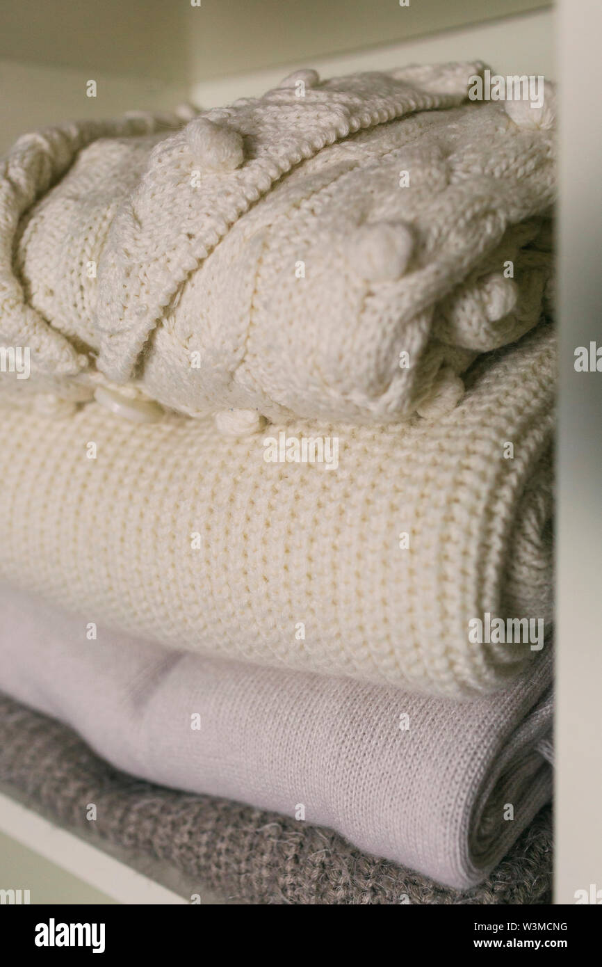 Stack of folded sweaters Stock Photo - Alamy