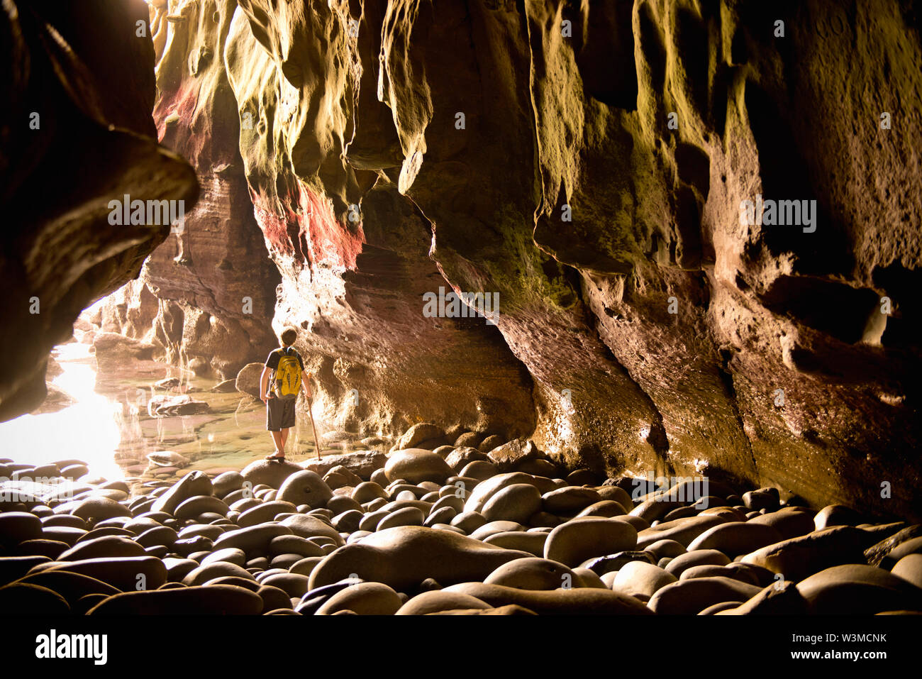 Boy exploring cave hi-res stock photography and images - Alamy