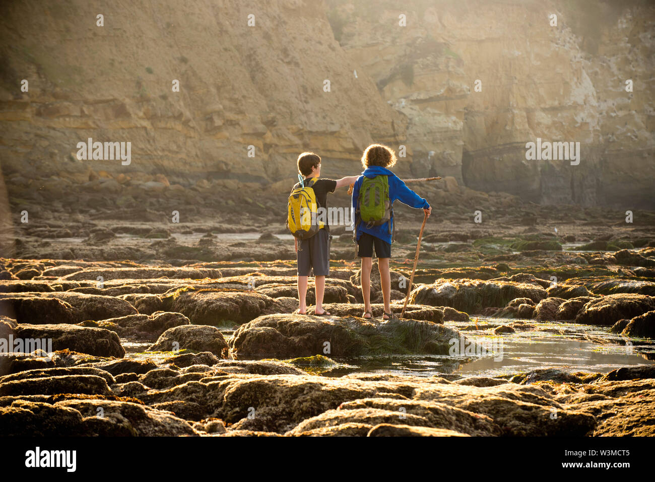 African boys by the sea rocks hi-res stock photography and images - Alamy