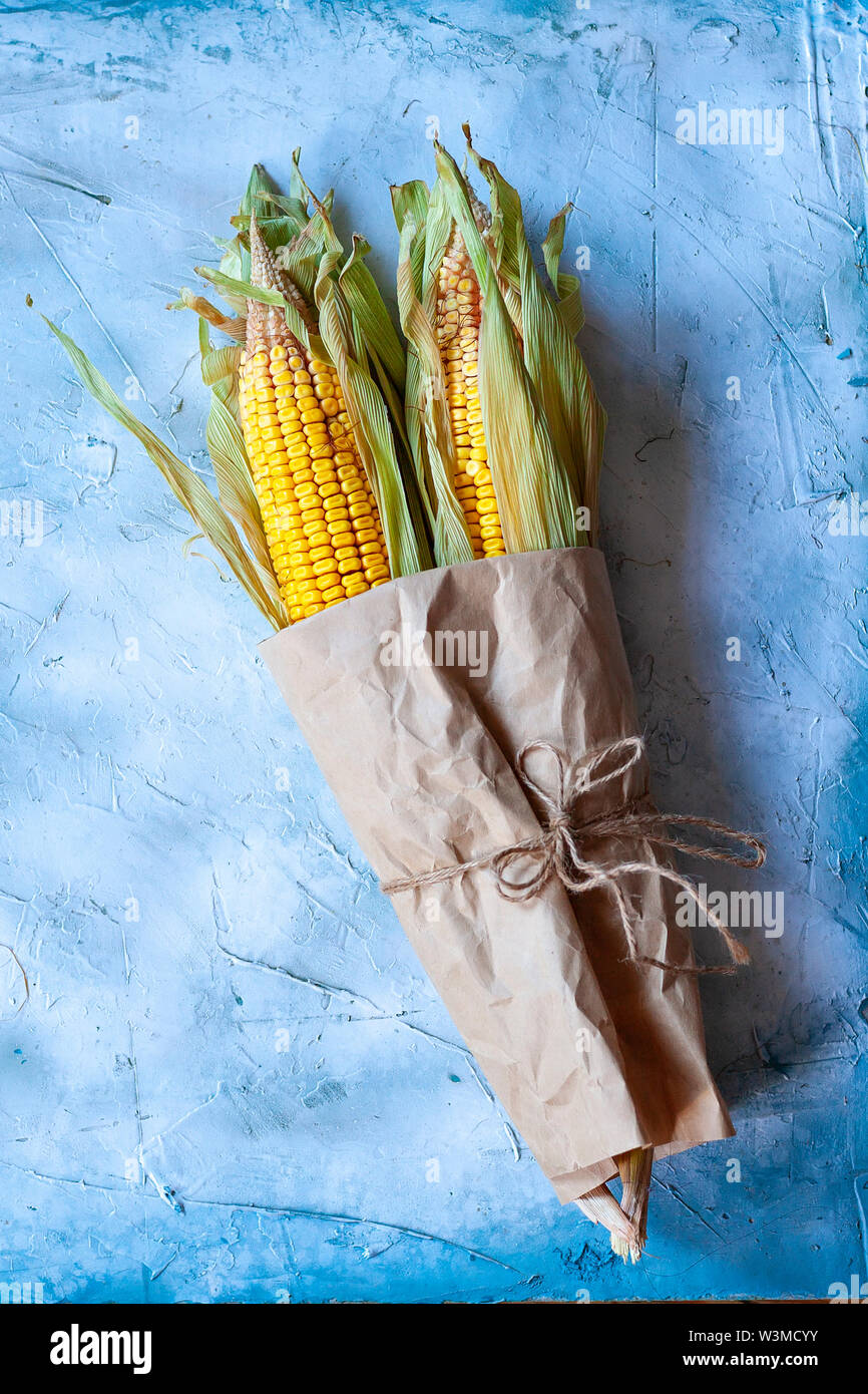 Corn bouquet on bright blue background. Bouquet made with partially ...