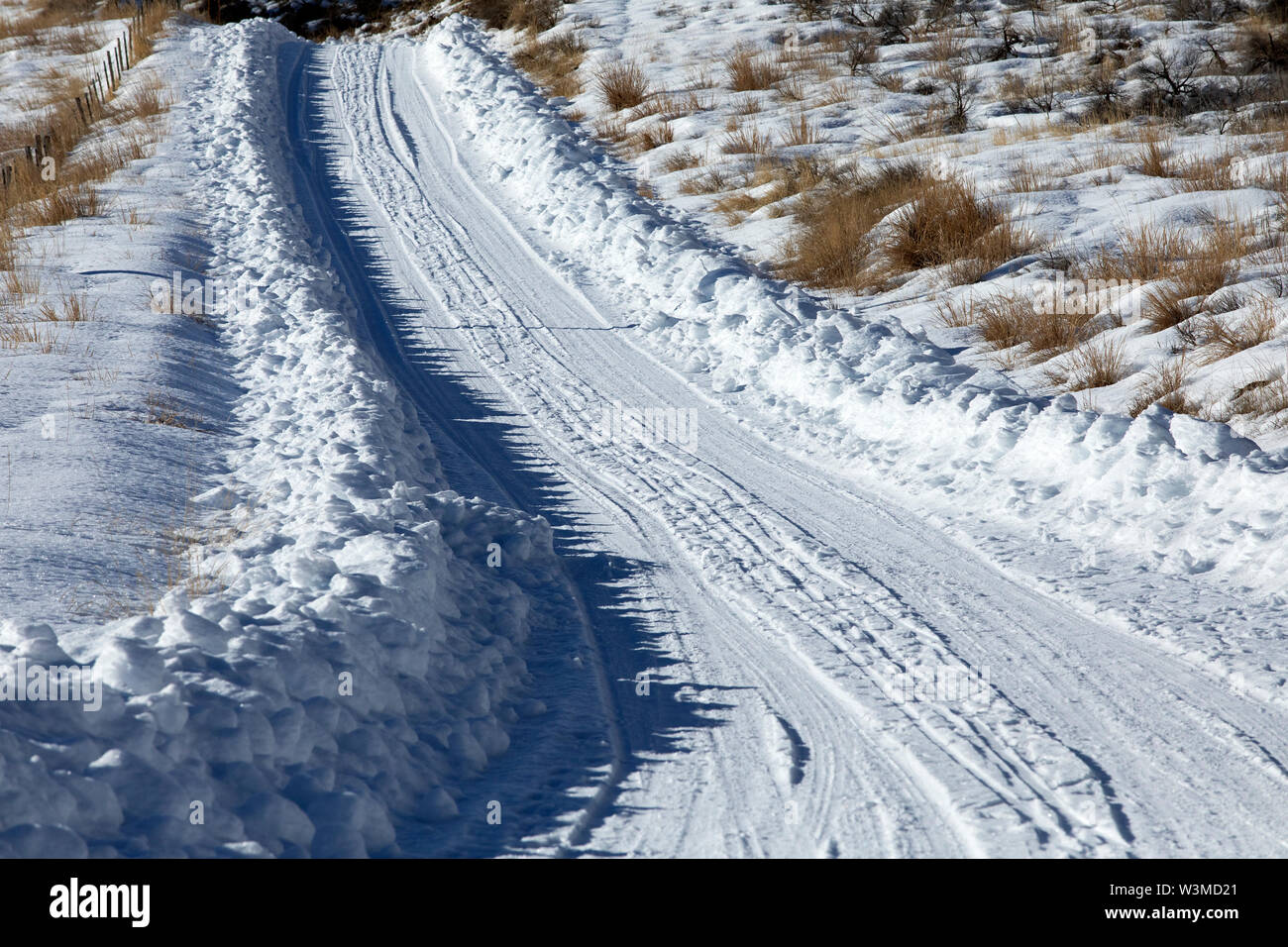 Tire tracks through snow Stock Photo - Alamy