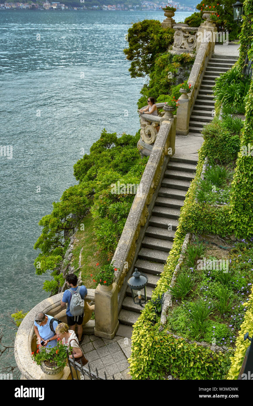 LENNO, LAKE COMO, ITALY - JUNE 2019: People on a balcony in the grounds ...