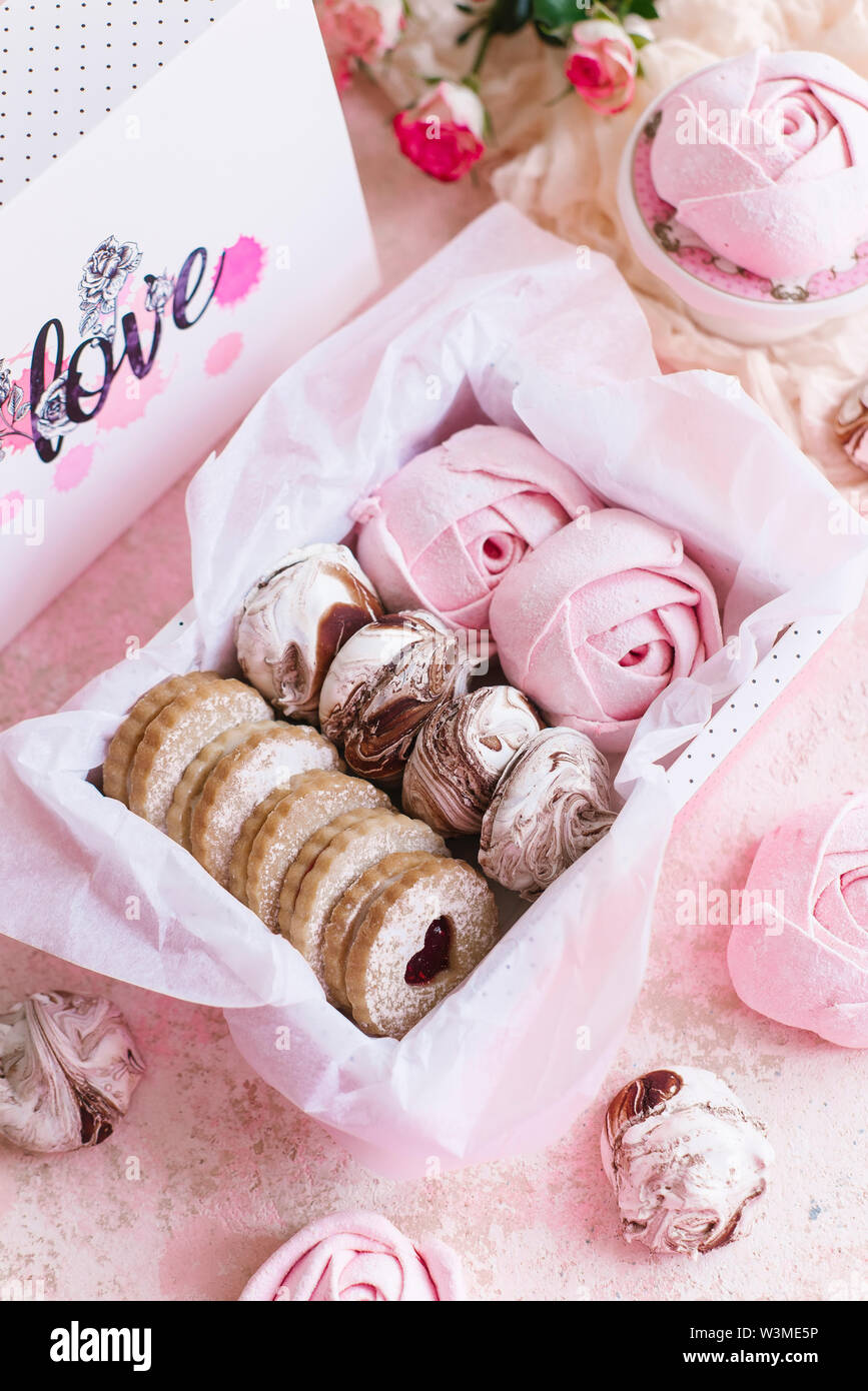 Pink box of biscuits and candy Stock Photo - Alamy