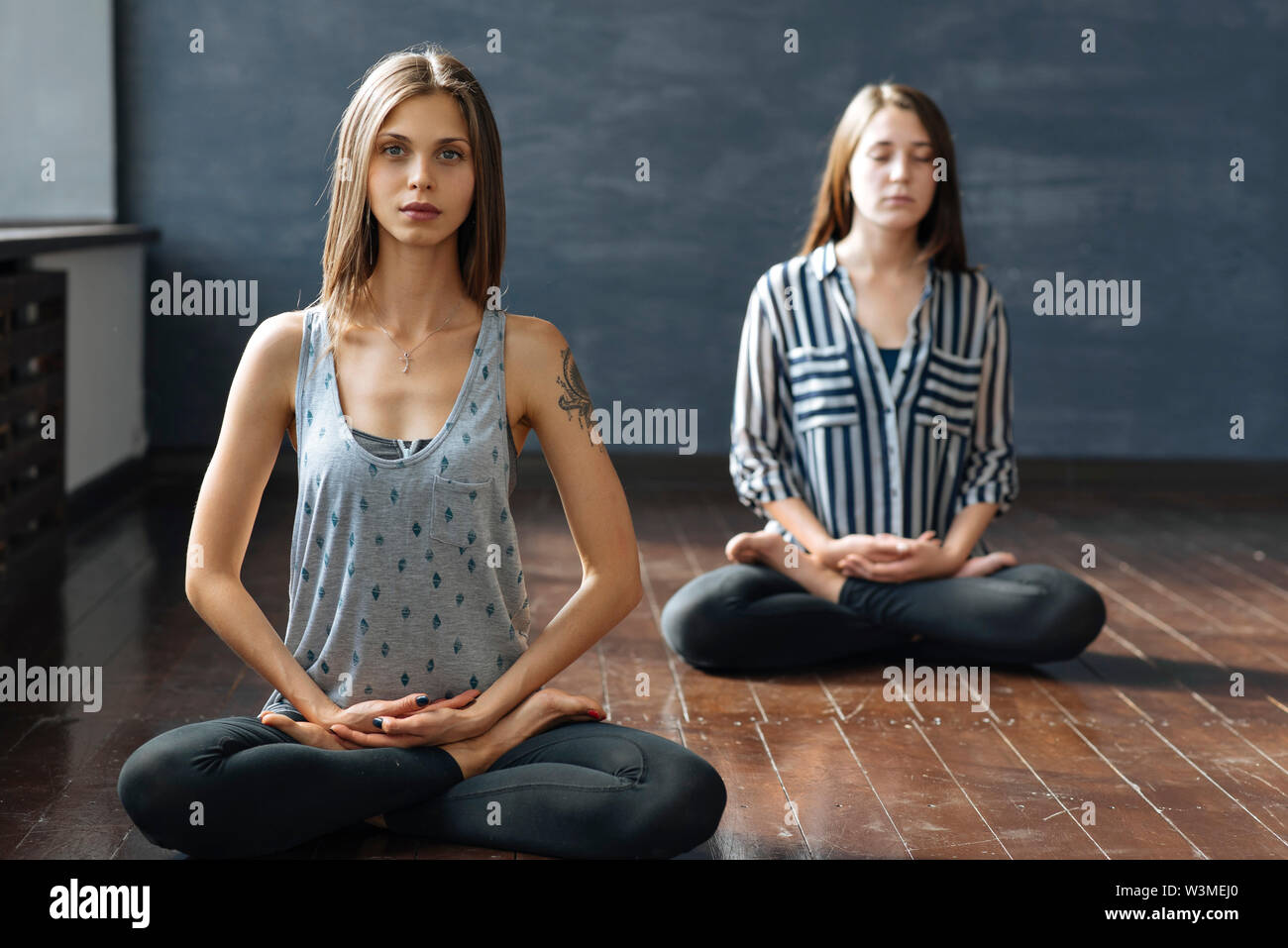 Women during yoga class Stock Photo - Alamy