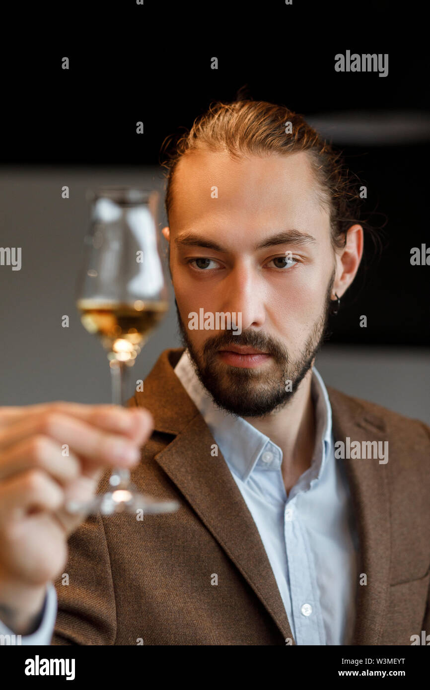Young sommelier holding glass hi-res stock photography and images - Alamy