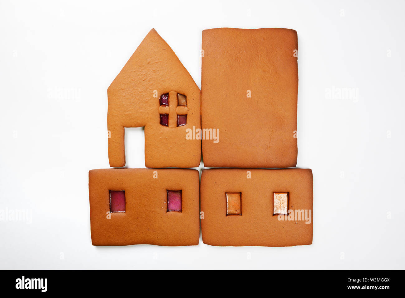 The hand-made eatable gingerbread parts of house on white background ...
