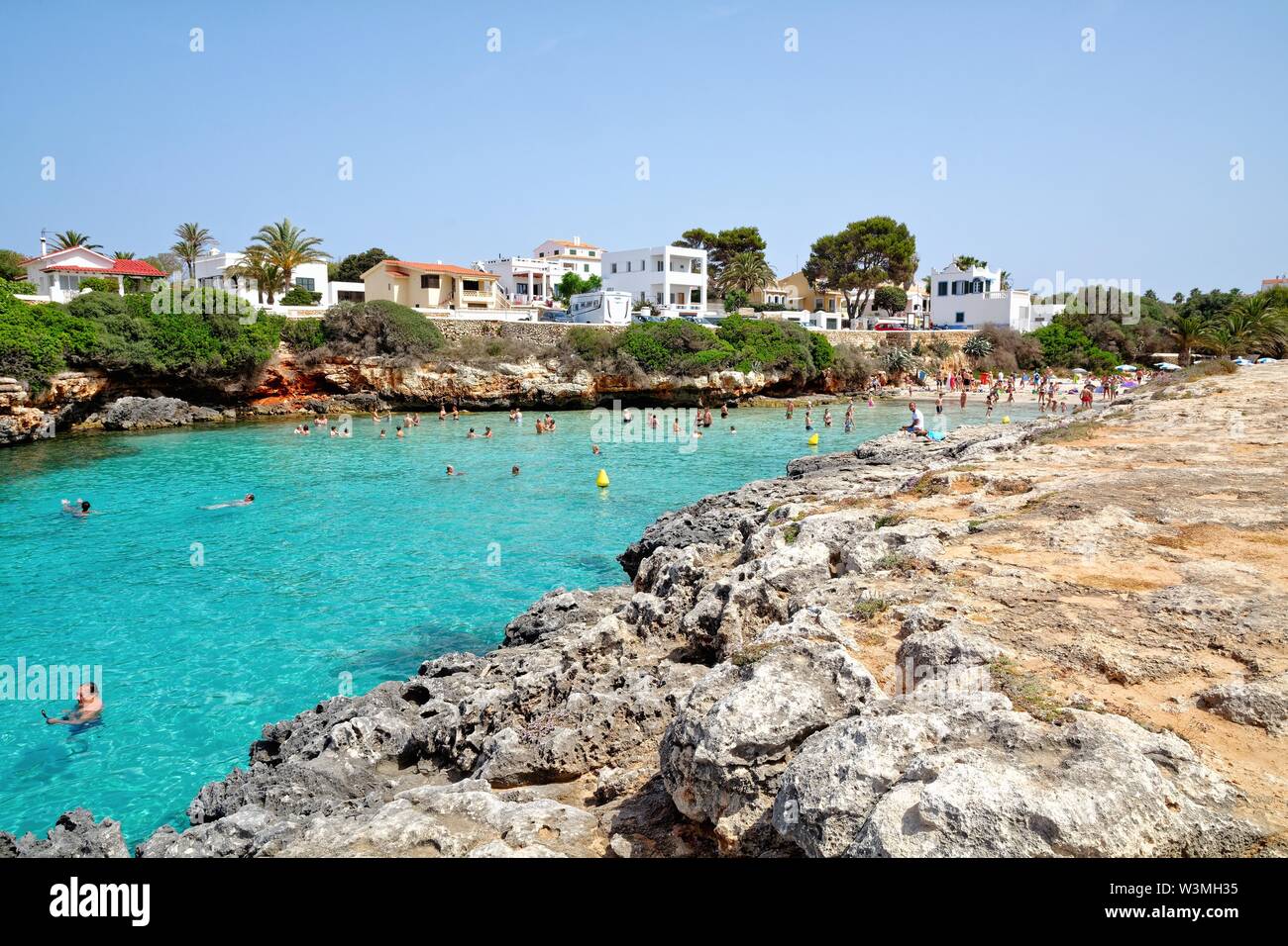 The beach and cove at Sa Caleta on a hot summers day,Cala Santandria ...