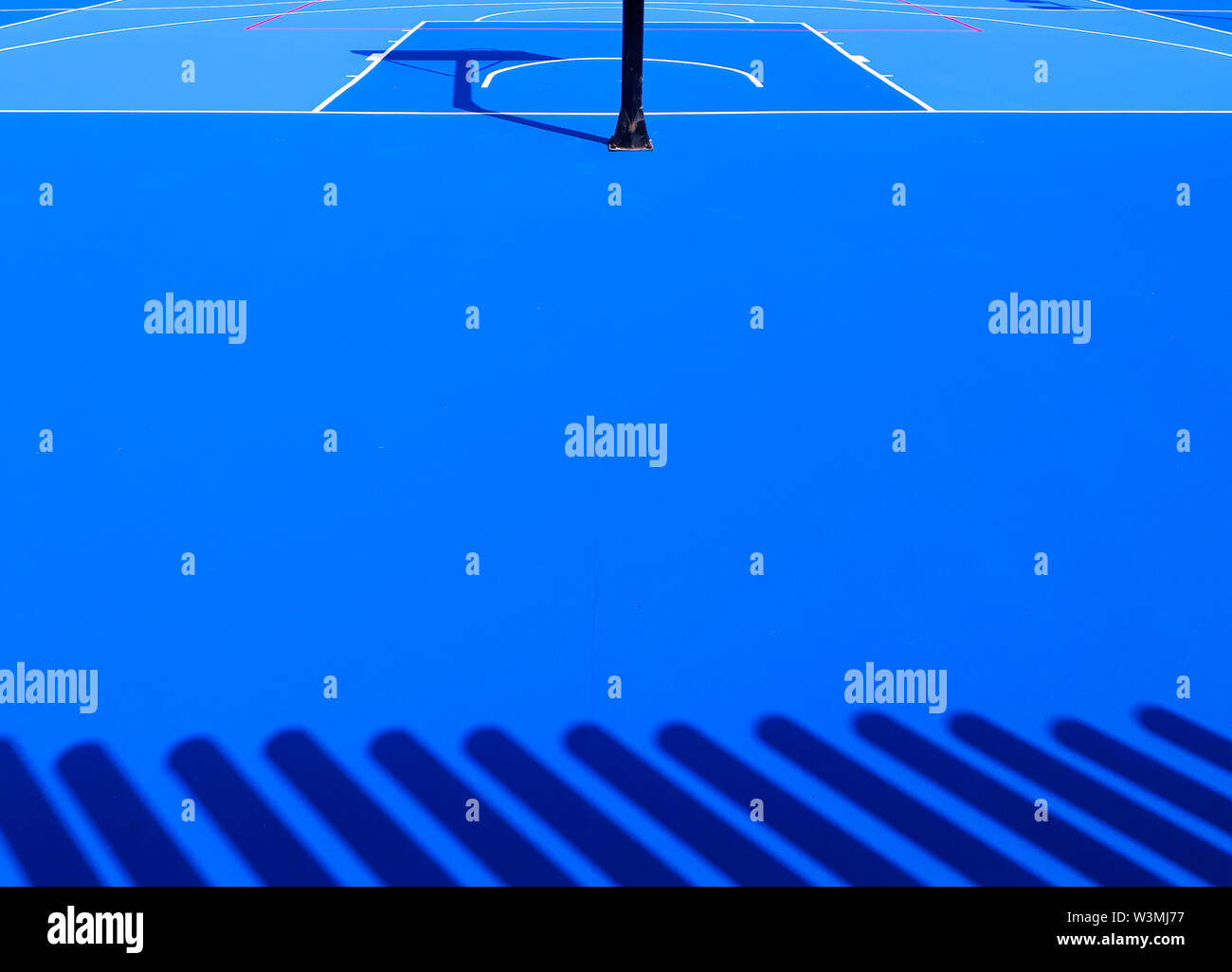 Floor background of an intense blue sports field with white lines Stock ...