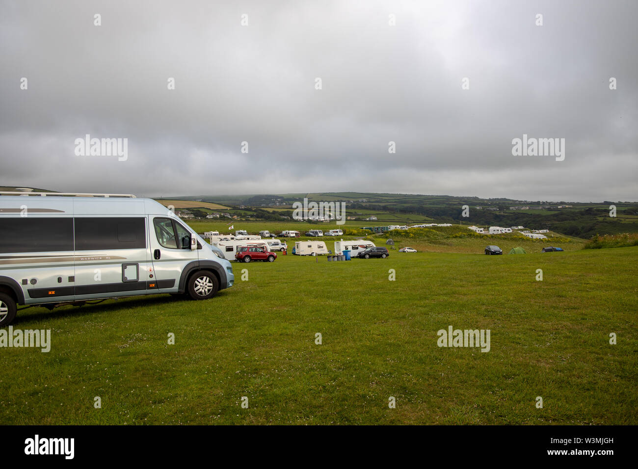 Blue Campervan on a countryside campsite Stock Photo - Alamy
