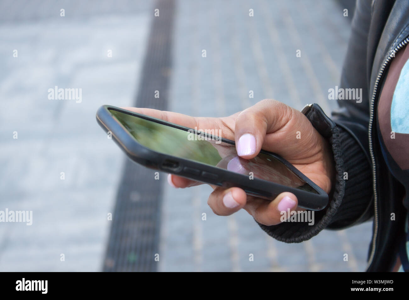 Black hand street hi-res stock photography and images - Alamy