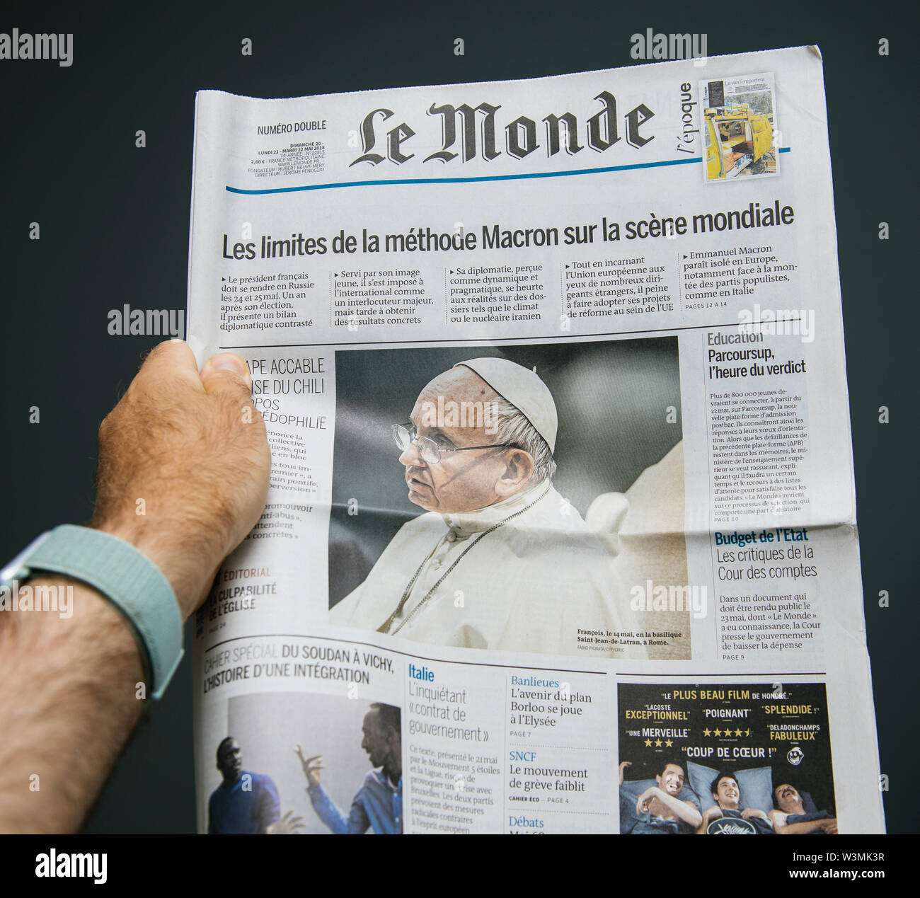 Paris, France - Jun 7, 2018: Man hand holding reading Le Monde ...