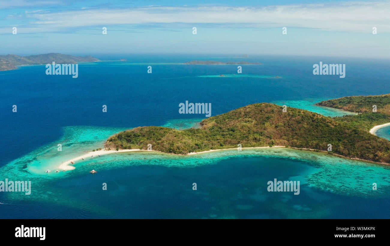 aerial seascape tropical island with sand bar, turquoise water and ...