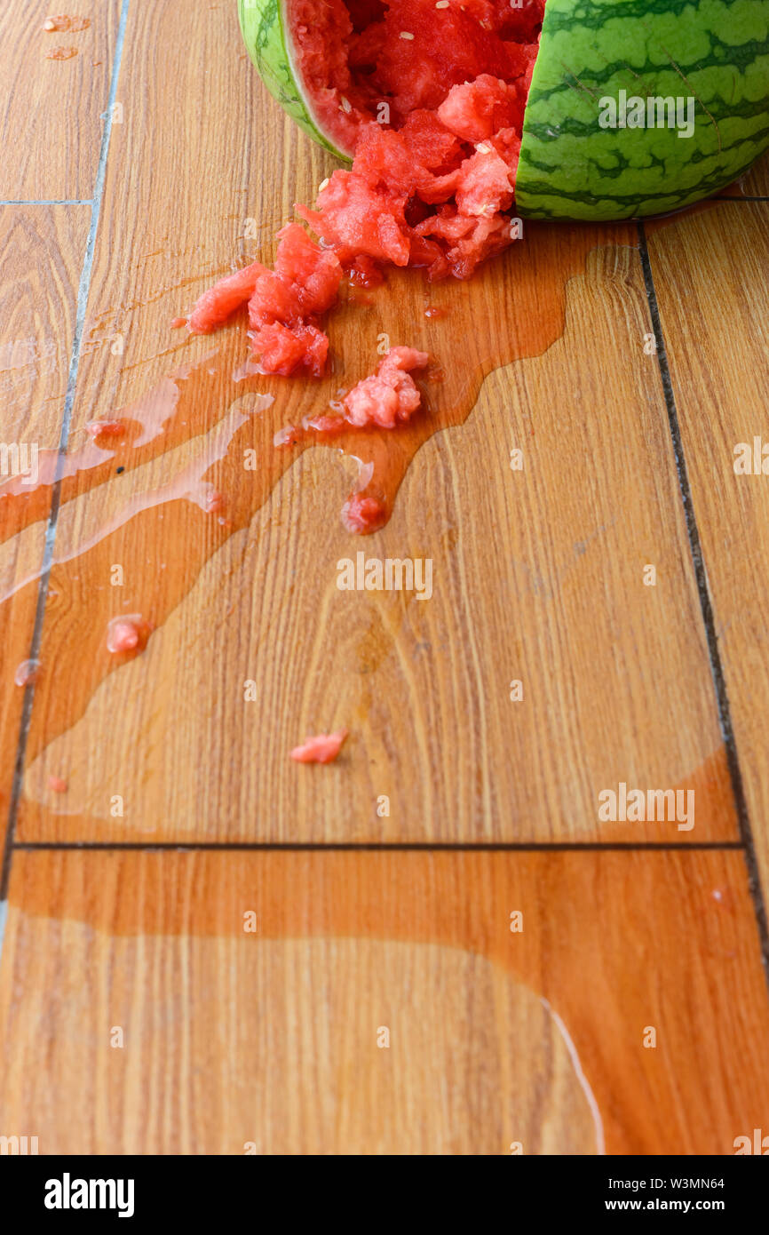 smashed watermelon on the ground vertical composition Stock Photo - Alamy