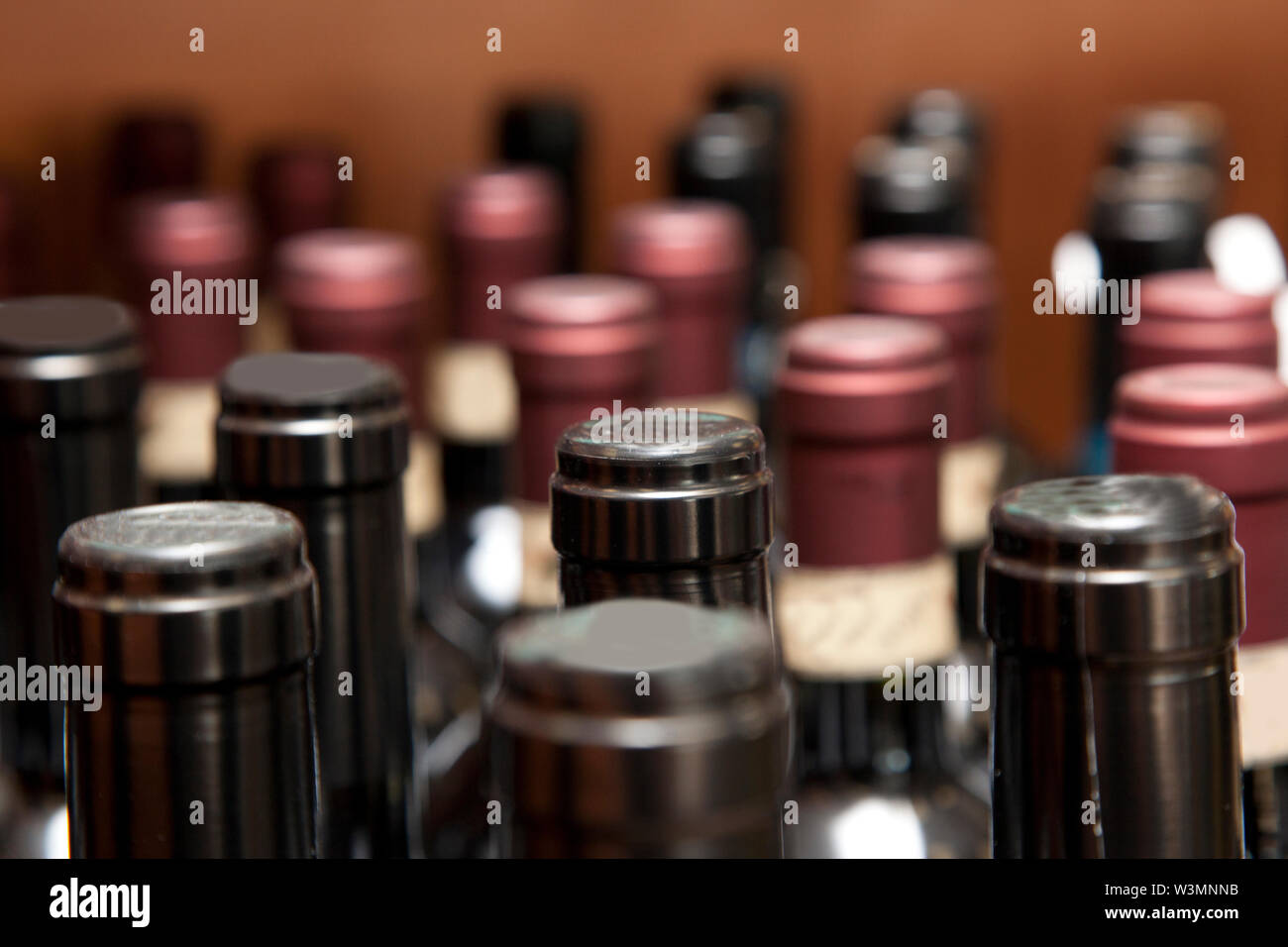 a variety of assorted wines, shown from the neck or top Stock Photo - Alamy