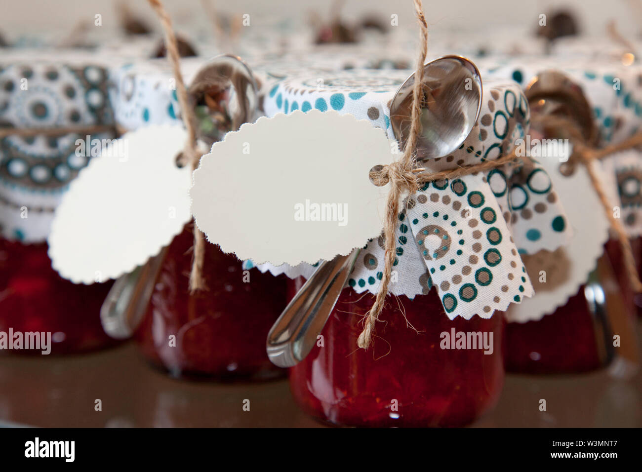 Wedding gift of jars of sweet strawberry jam Stock Photo - Alamy