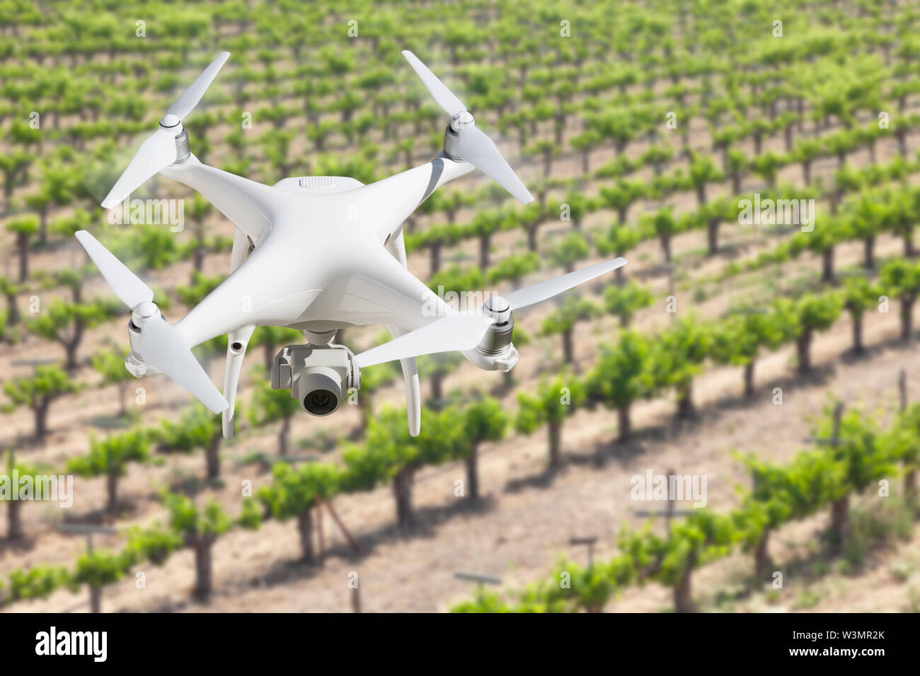 Unmanned Aircraft System (UAV) Quadcopter Drone In The Air Over Grape Vineyard Farm Stock Photo ...