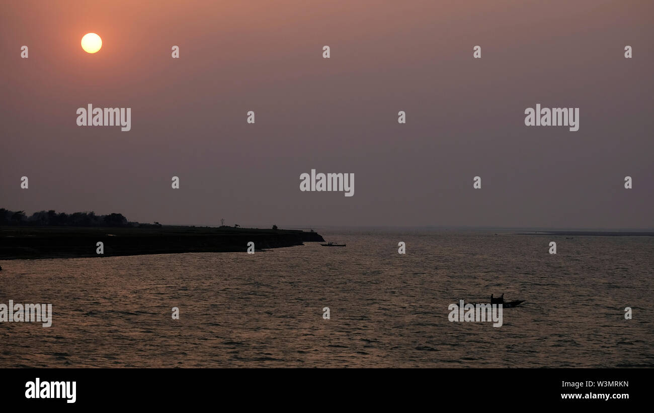 Boats on the river during sunset. Bangladesh. 2015 Stock Photo - Alamy