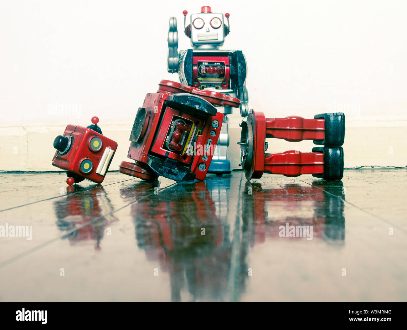 robot wars red robot defeated on old wooden floor Stock Photo - Alamy