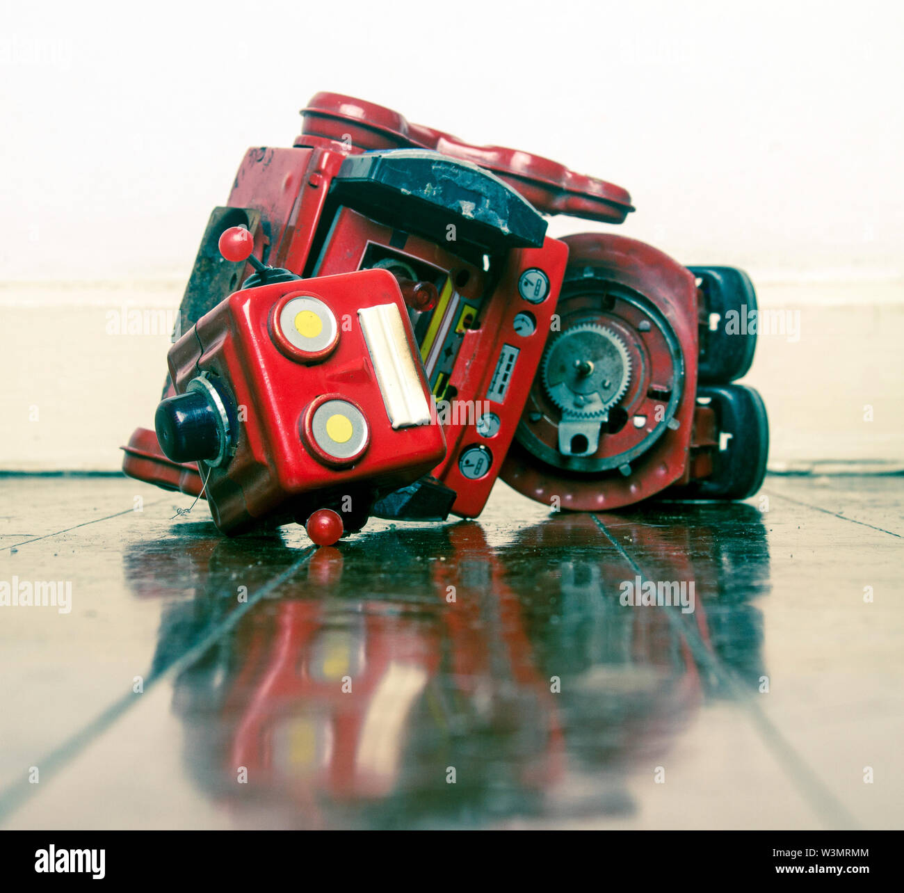 robot wars red robot defeated on old wooden floor Stock Photo - Alamy